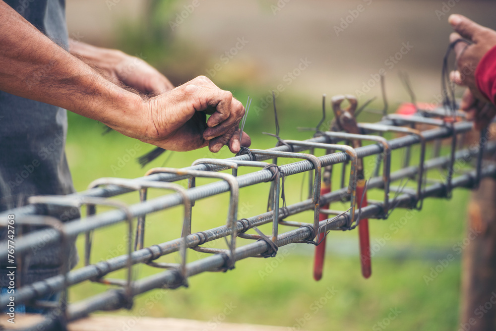 Construction Worker hands using pincer pliers iron wire. Outdoor Worker ...