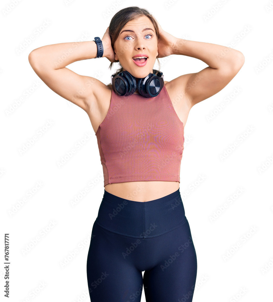 Beautiful caucasian young woman wearing gym clothes and using ...