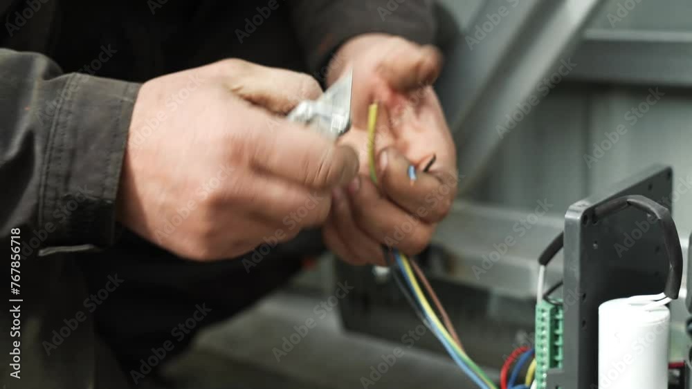 Electrician installs wiring using Connectors for connecting wires in ...