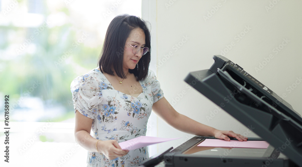 Asian beautiful women using photocopier for photocopy documents. Soft ...