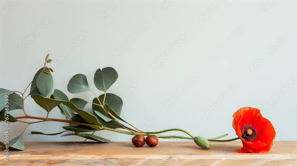 Foto de Red poppy flower leaves on wood table ANZAC Remembrance day in ...
