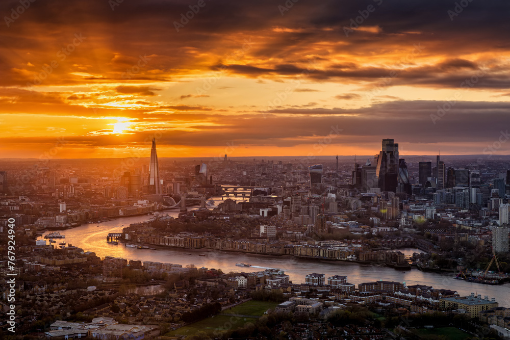 Elevated view of a beautiful sunset with orange and red colors behind ...