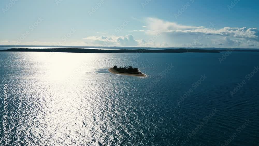 Aerial footage of the Round Island Hervey Bay on a sunny day in ...