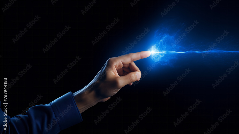 A human finger touching a spark of electrical energy illustrating a ...
