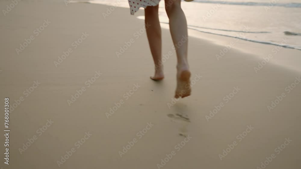 Female feet running barefoot on tropical sandy beach at summer sunset ...