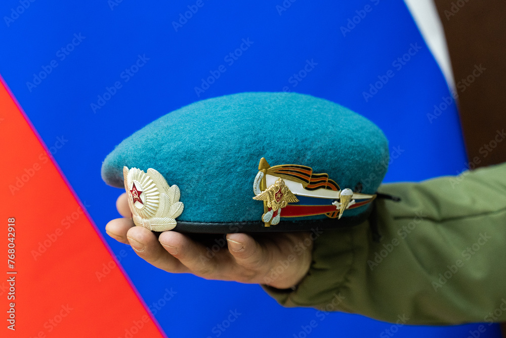 Russian Army soldier holds his head beret against the background of the ...