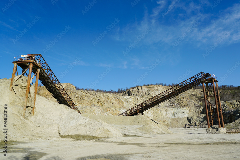 Huge rusty metal structures for transporting rocks in a dolomite mining ...
