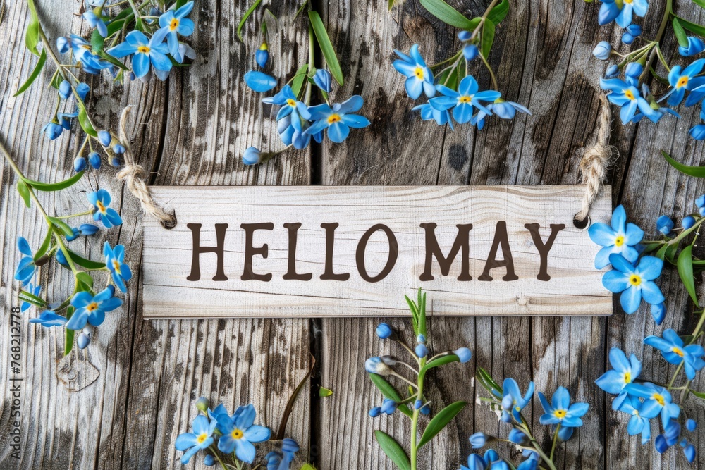 "HELLO MAY", text, wooden background with blue flowers, white wood ...