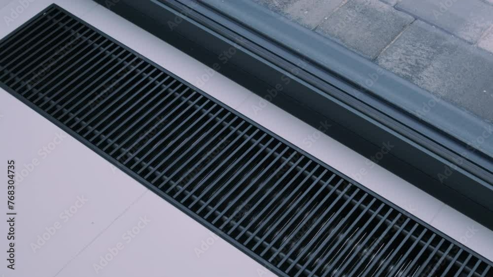 A modern linear floor vent providing efficient air circulation in a ...