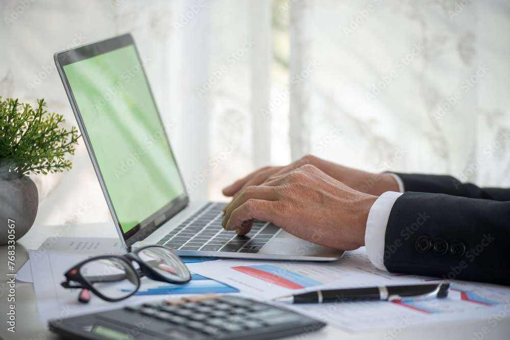 Closeup businessman hands working use laptop finance business document ...