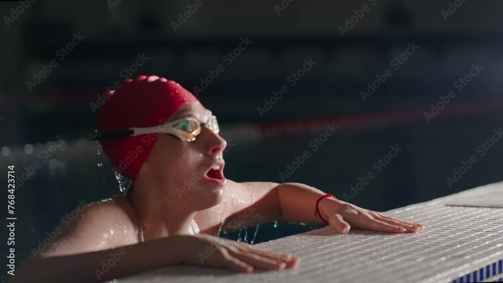 Vidéo Stock Tired Female Swimmer Emerging Out From Water In Swimming ...
