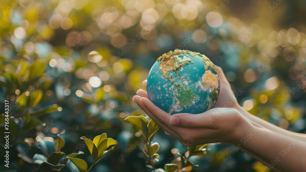 Human hand holding green earth with environmental icons sustainable ...