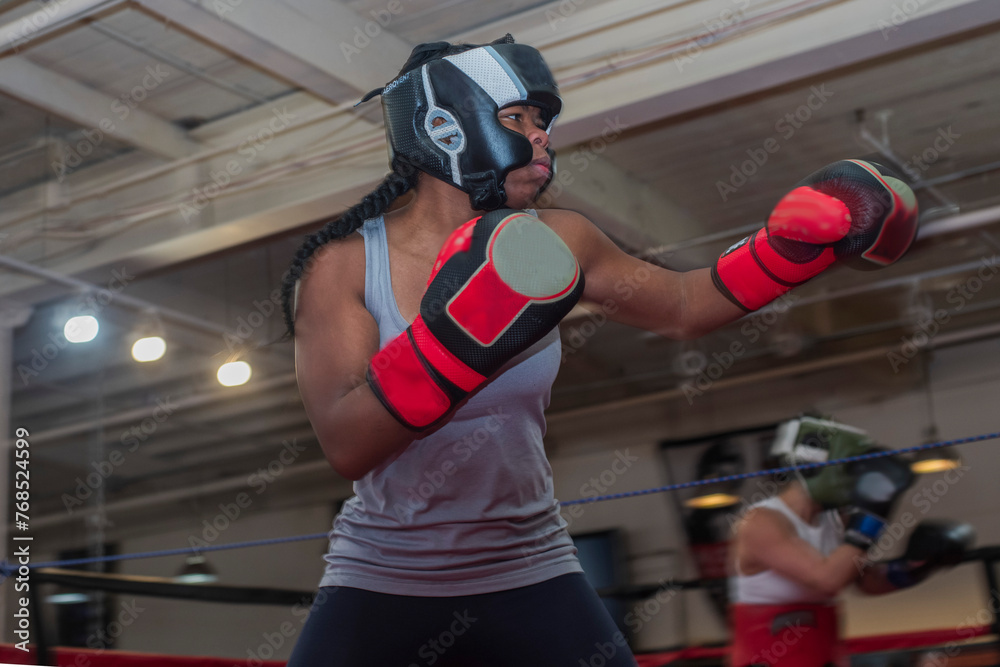Young Girl sparring with partner in boxing ring Stock Photo | Adobe Stock