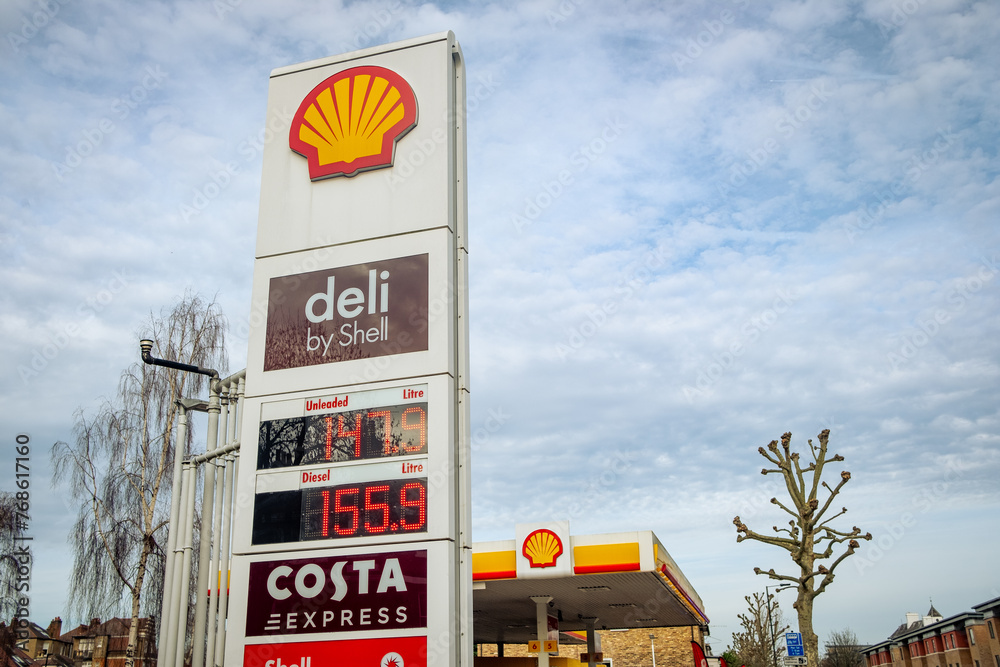LONDON- Shell fuel station sign with Deli By Shell convenience store ...