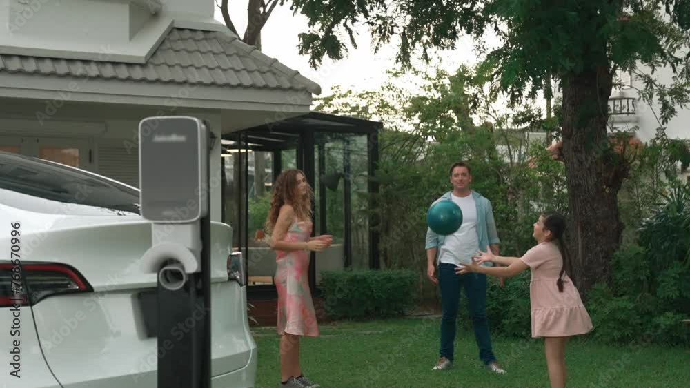 Vidéo Stock Electric vehicle recharge from home charging station on ...