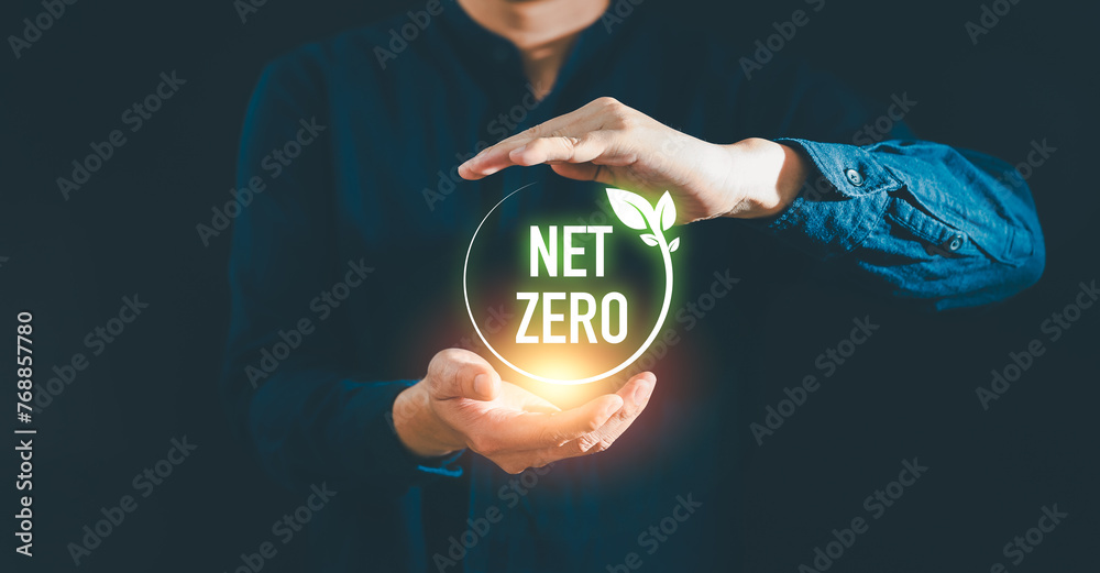 Businessman holding net zero icon with globe outline background for Net ...