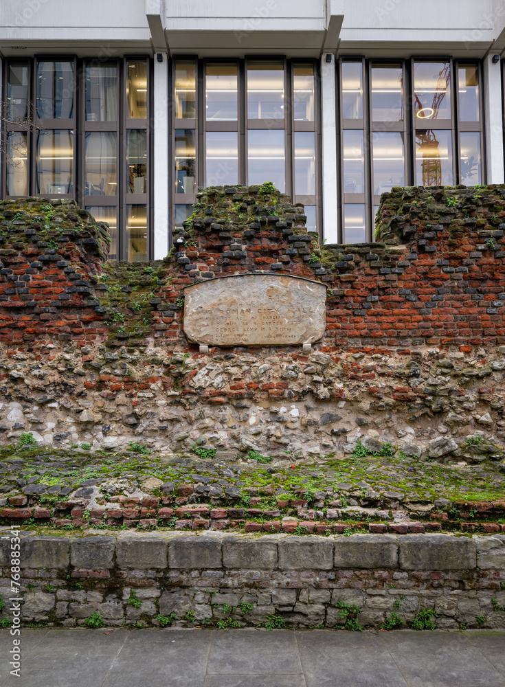 London, UK: Part of the ancient city wall of London. This is a medieval ...