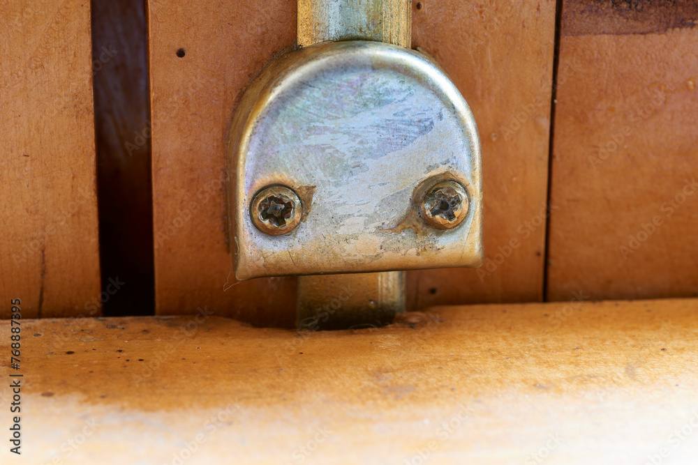 A close-up view of a window latch mechanism, emphasizing the contrast ...