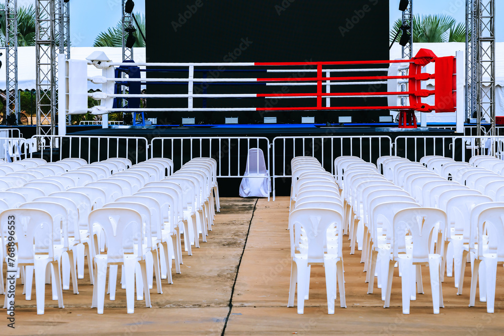 Boxing ring and many chairs for spectators prepared for competition ...