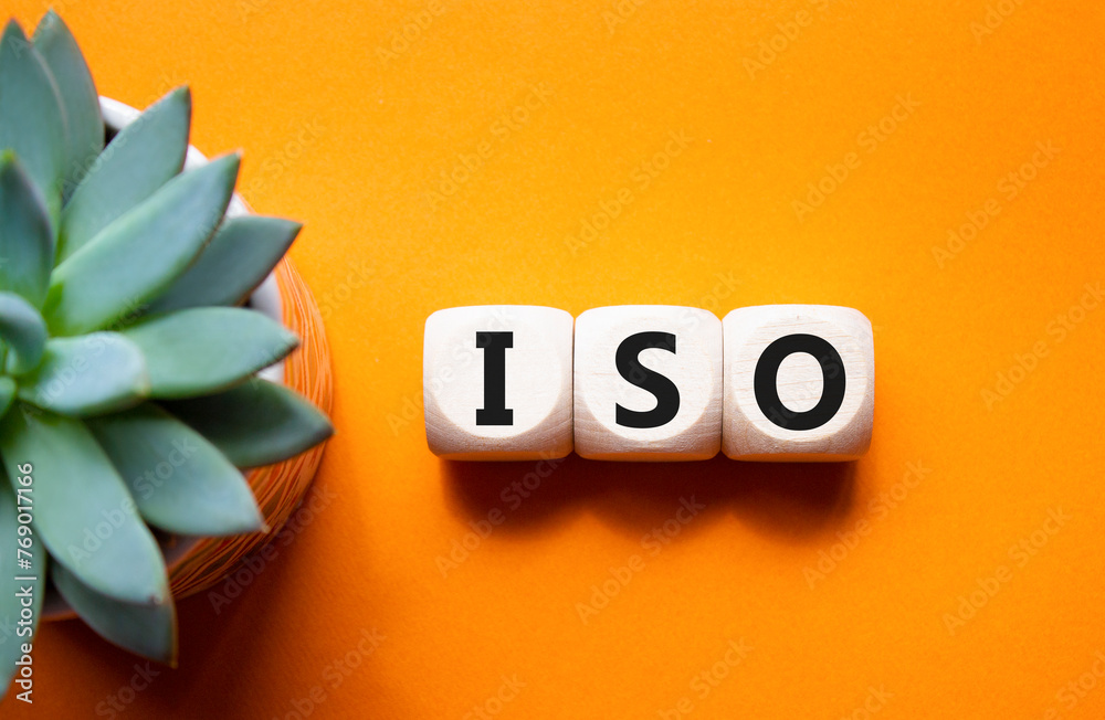 ISO standards quality control symbol. Concept word ISO on wooden cubes ...