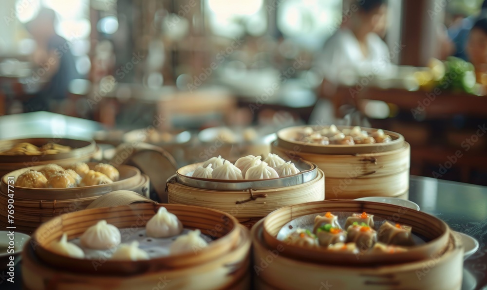 Dim sum in bamboo steamers at a restaurant - A variety of dim sum in ...