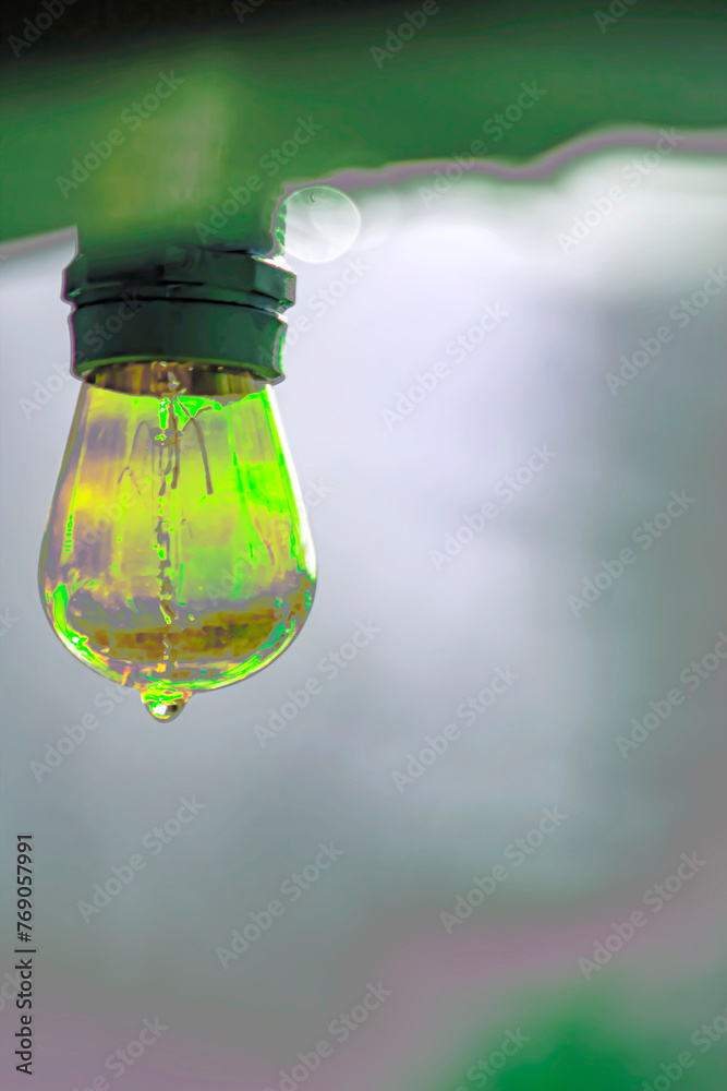 Illuminated Neon Green Lightbulb with Drip of Rainwater Background ...