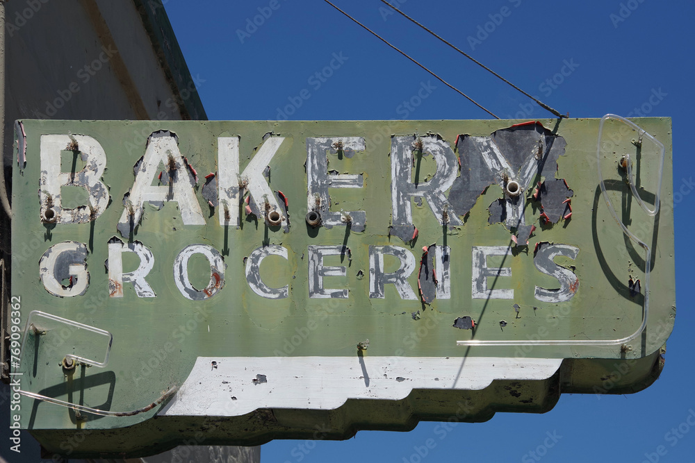 Poster Old faded defunct broken former neon sign BAKERY GROCERIES ...
