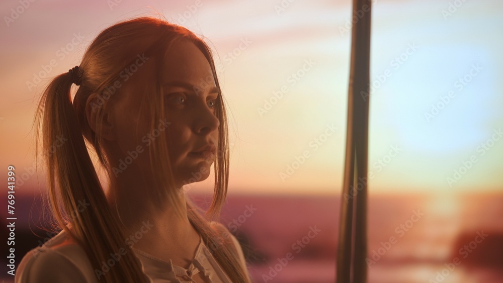 Person with sword posing at camera. Young woman in anime style outfit ...