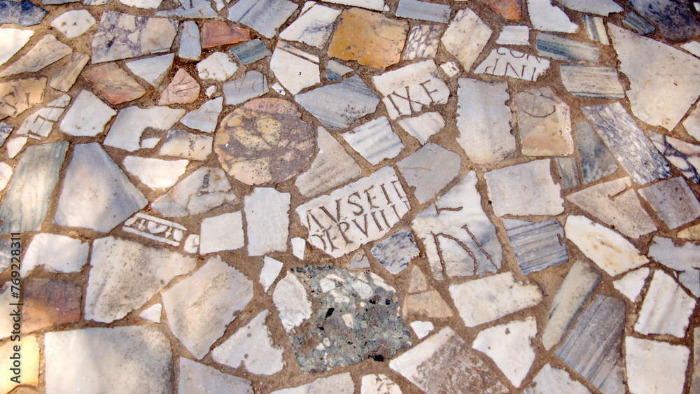 Stones with Roman inscriptions used to make a floor in the Carthaginian ...