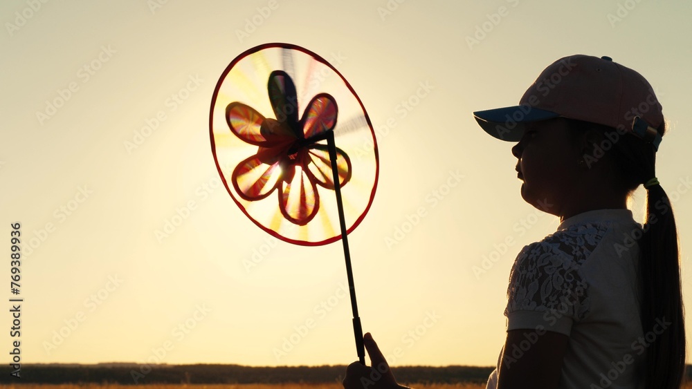 silhouette girls with toy spinner, sun wind toy spinner, family kid ...