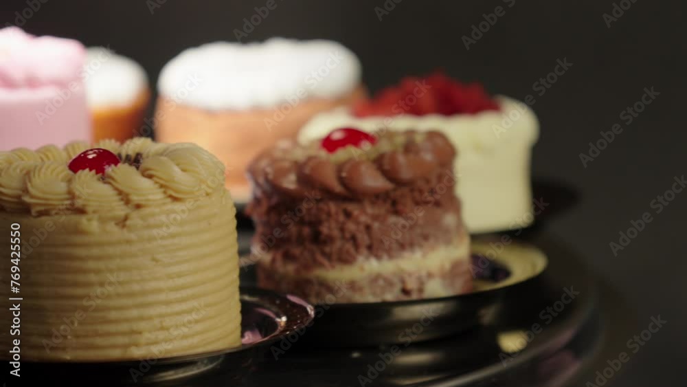 mini cakes spinning in turn table collection menu bakery pastry shop ...