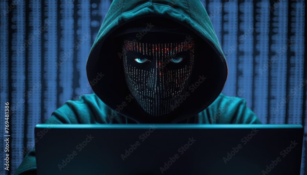 Hacker in hoodie sitting in front of a monitors with Somalia flag ...