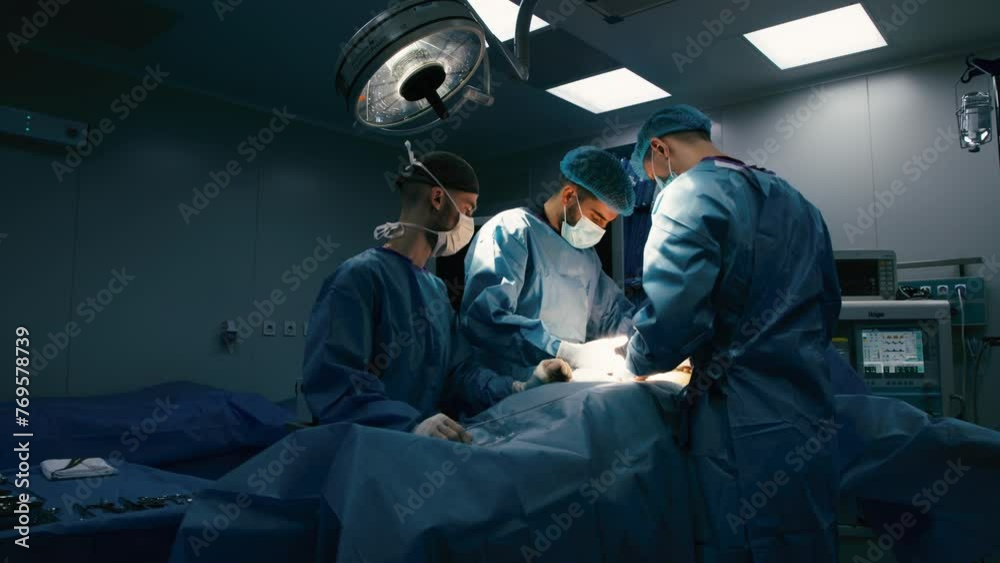 A group of professional surgeons in the operating room. Close-up of a ...