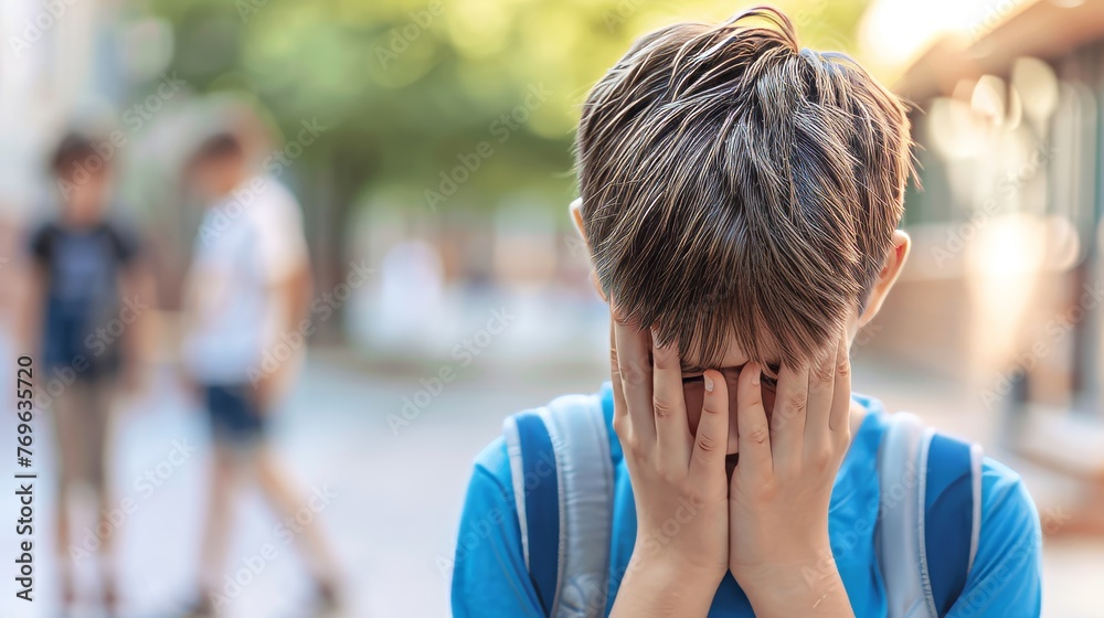 Sad teenage boy crying in school corridor, learning difficulties ...