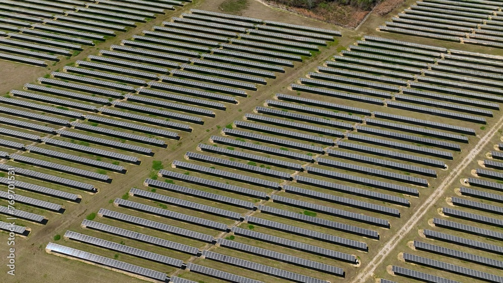 Solar panel farm producing sustainable energy located on countryside ...