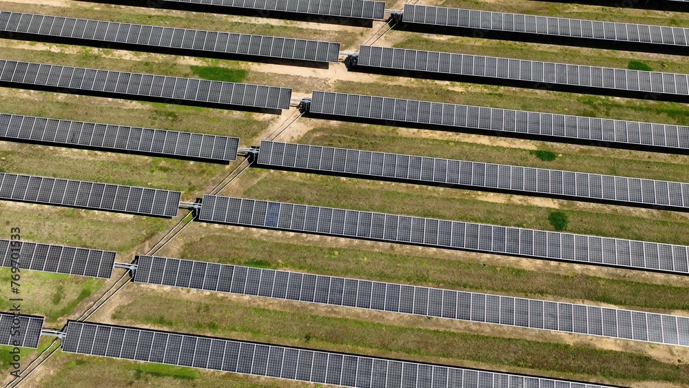 Solar panel farm producing sustainable energy located on countryside ...