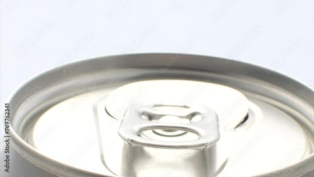 Close-up of the top of a soda can, capturing the metallic texture and ...