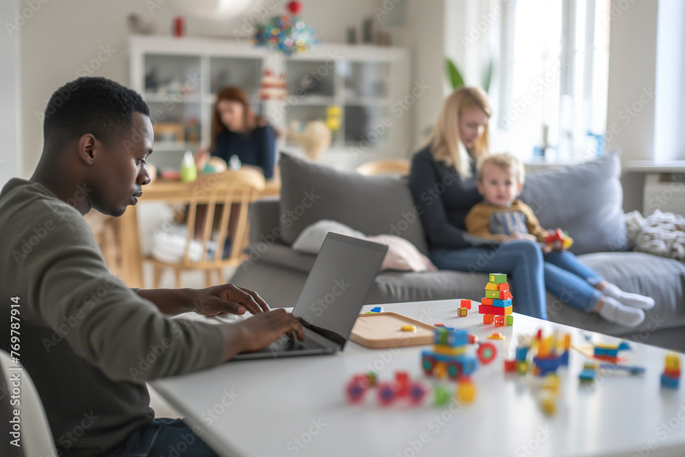Young Black parent dad distance working from home office with family ...