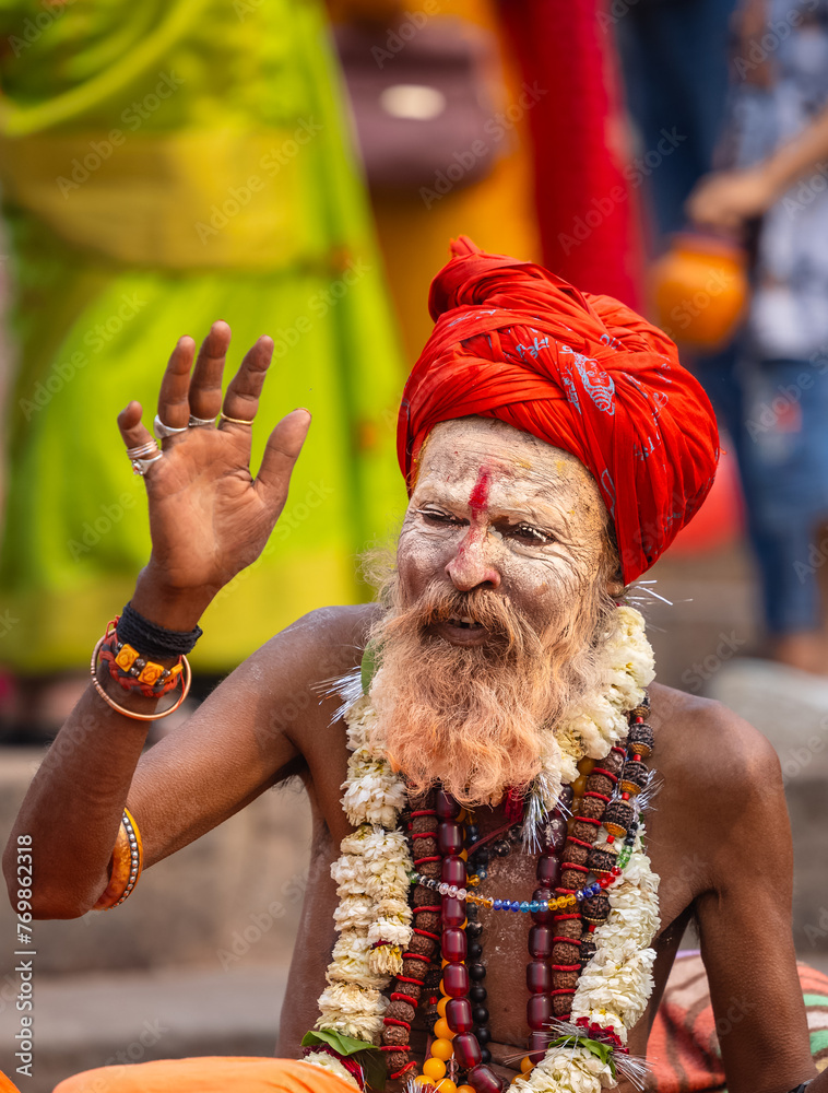 Portrait of an old sadhu baba with ash on his face sitting on ghats and ...