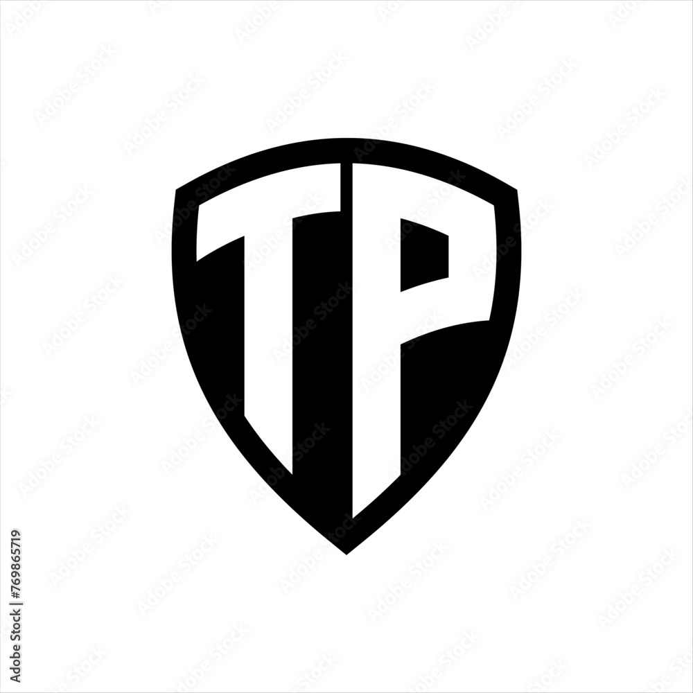TP monogram logo with bold letters shield shape with black and white ...