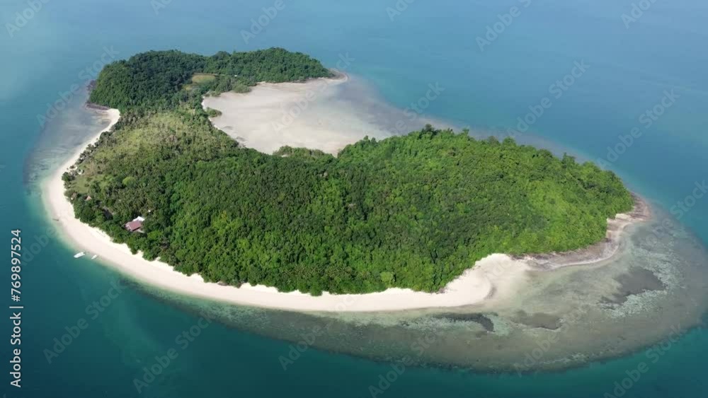 Aerial view of small tropical island which looks like a whale showing ...