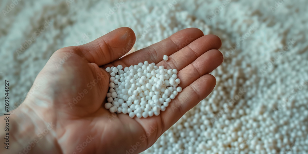Hand Holding White Plastic Resin Pellets for Plastic Manufacturing ...