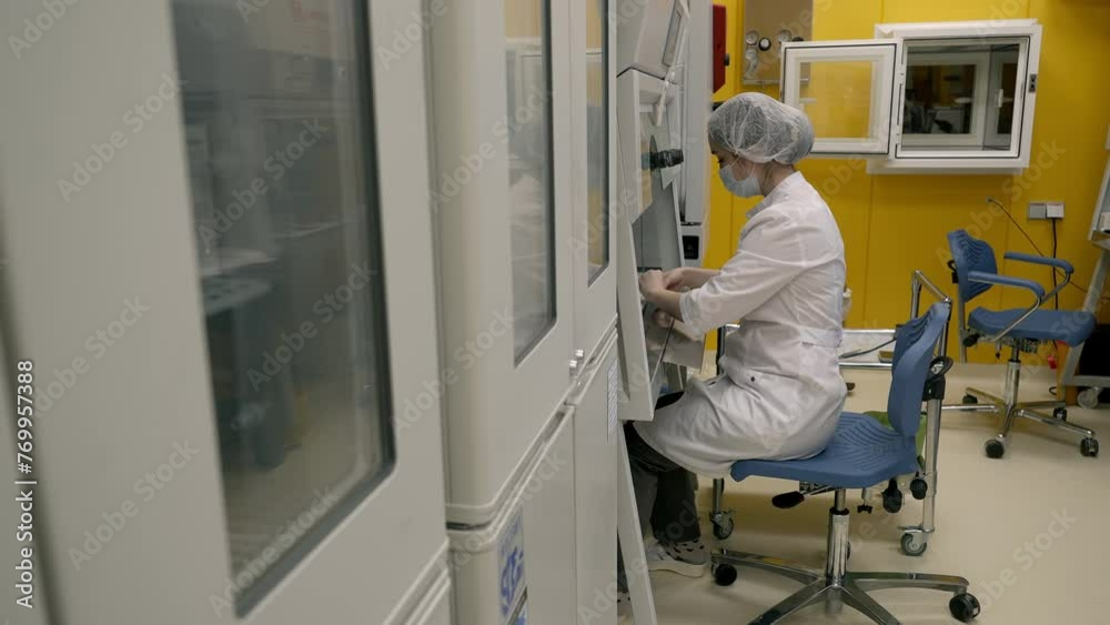 Doctor Analyzes Patient's Sample Using Medical Equipment In Laboratory ...