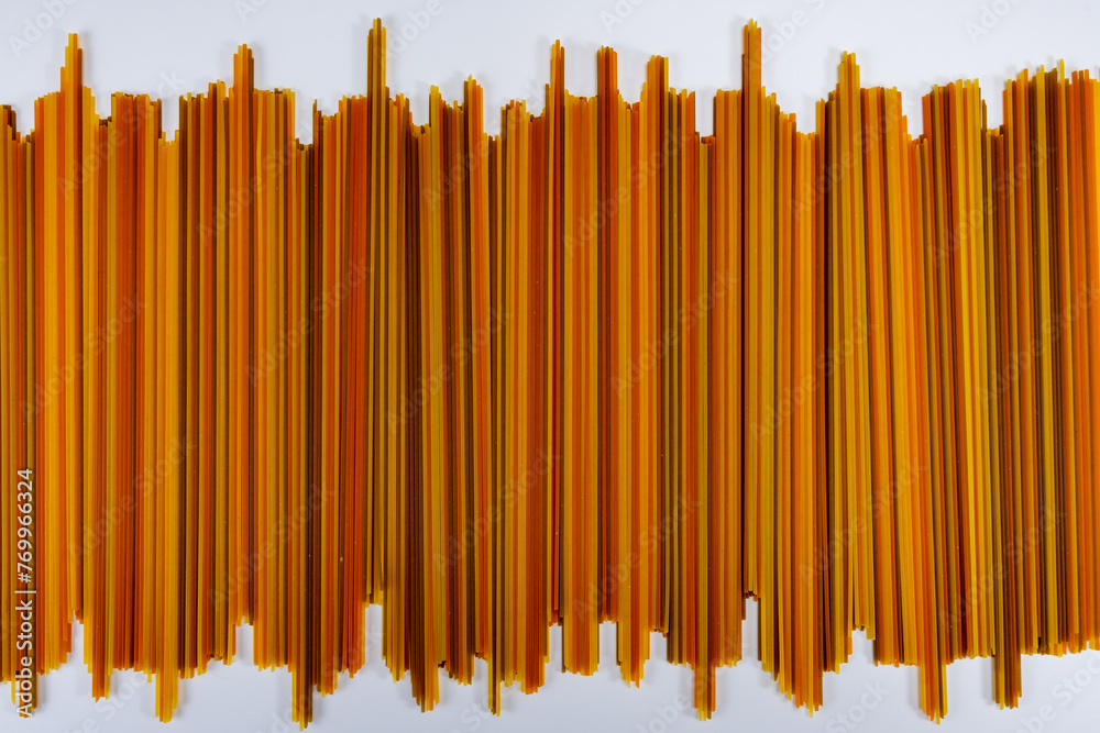 Food background, colorul dried pasta spaghetti, paralleled lines ...