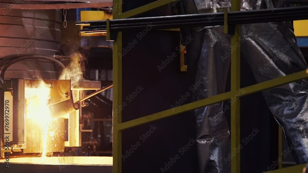 The process of casting the molten metal at the modern production ...