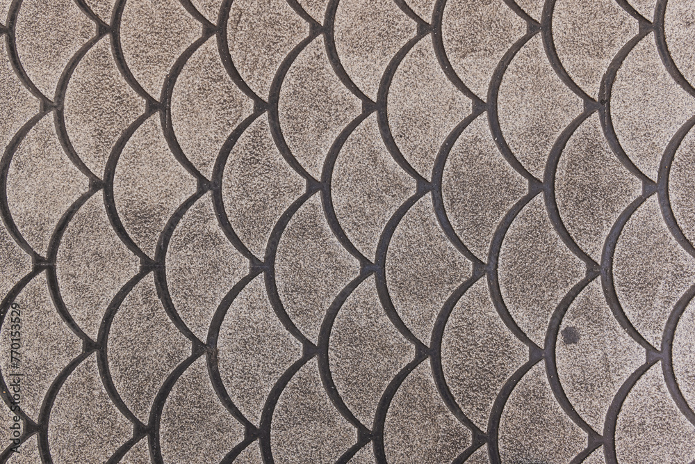 Tiles on a floor patterned to look like fish scales in a fish market in ...