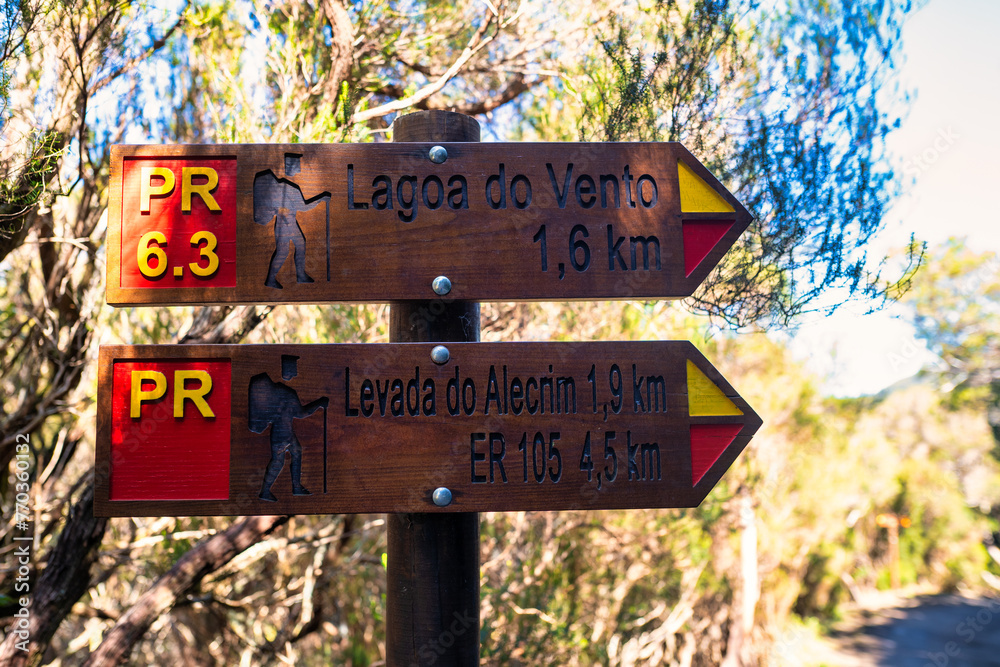 This photo depicts wooden signs in Madeira, indicating directions to ...