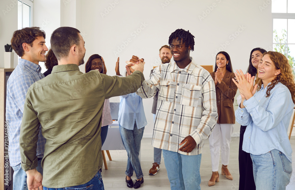 Diverse group of friends standing in a circle during meeting ...