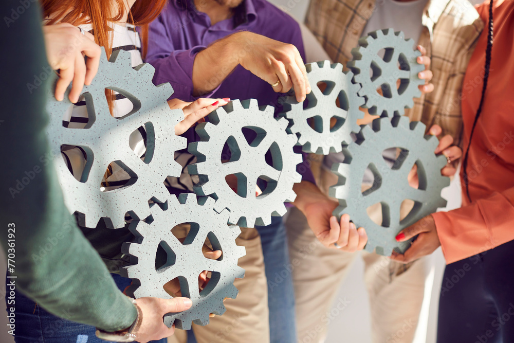 Close-up hands of a group of diverse friends or business people company ...