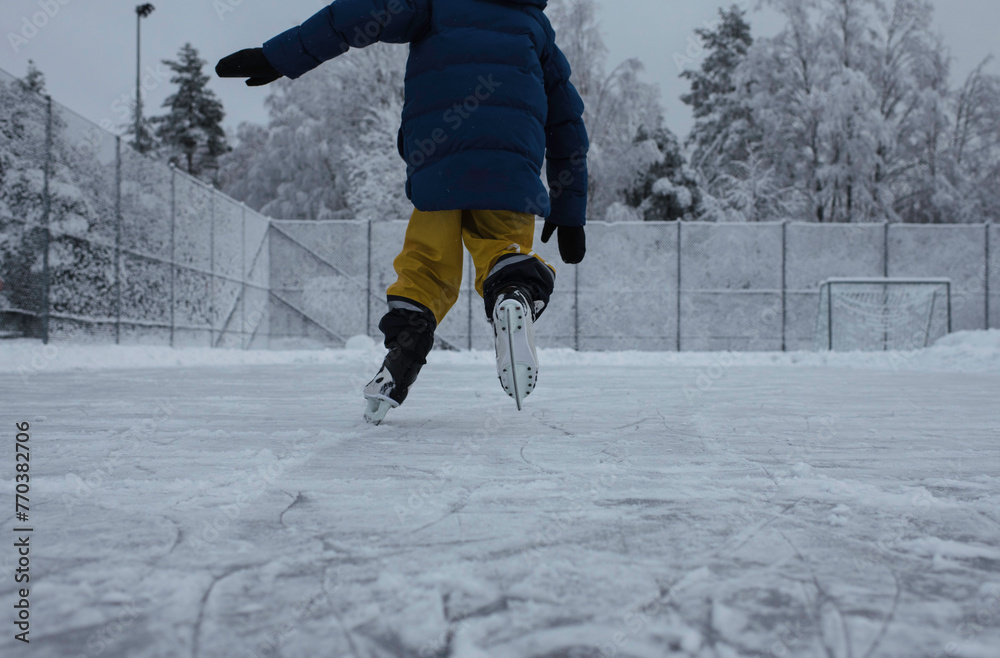 child ice skating in an outdoor ice rink in Stockholm Stock Photo ...